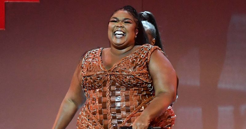 Lizzo hits back at body-shamers with epic workout video: 'Mind your fu ...