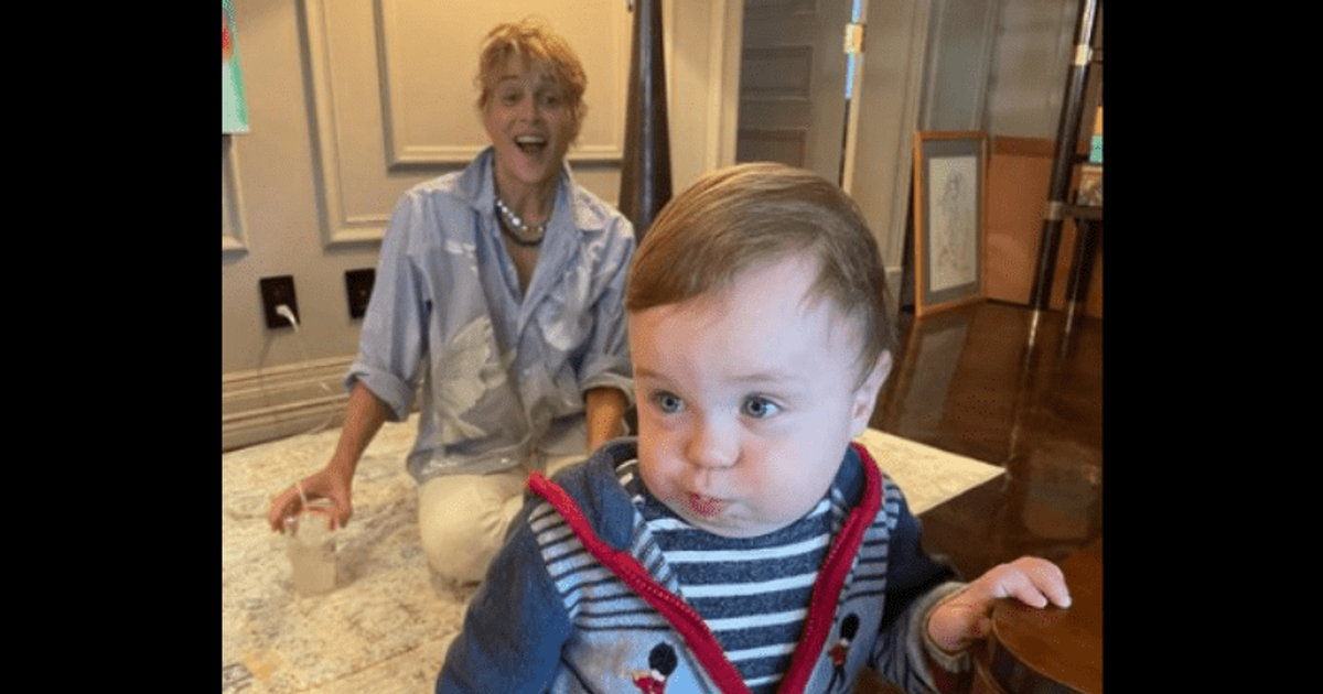 Sharon Stone gushes with pride as baby godson grips table and balances ...