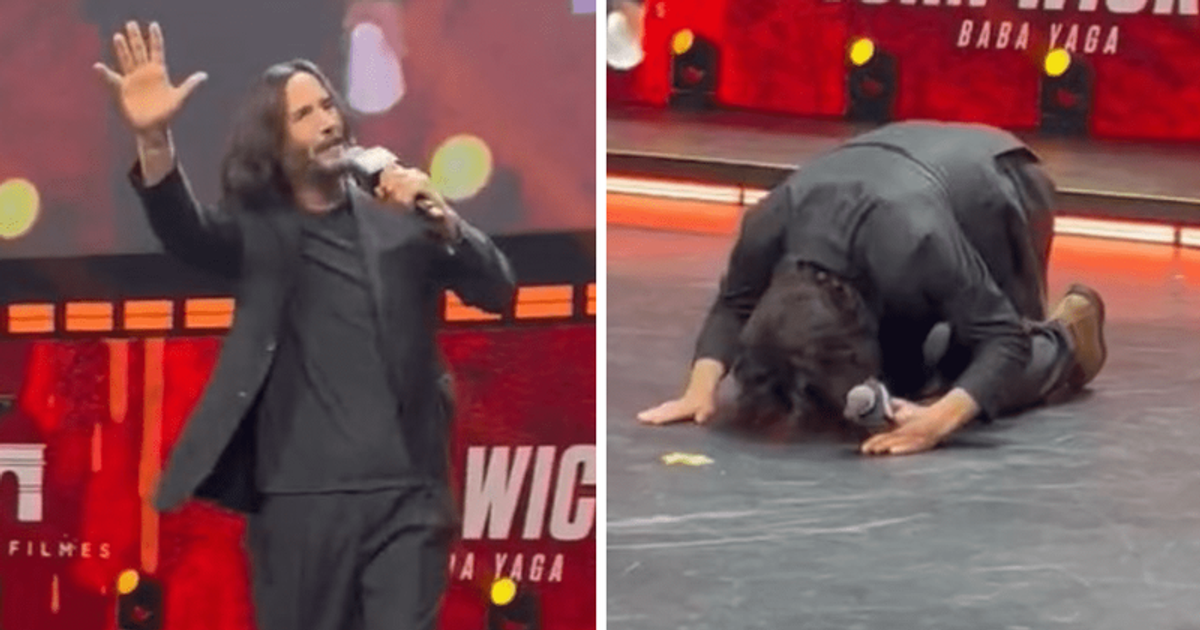 Keanu Reeves bows down on stage as fans give him a standing ovation at ...