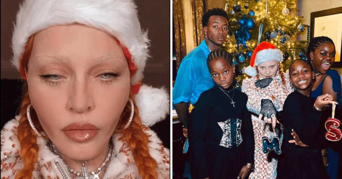 Madonna poses in Santa hat in front of Christmas tree as she spends ...