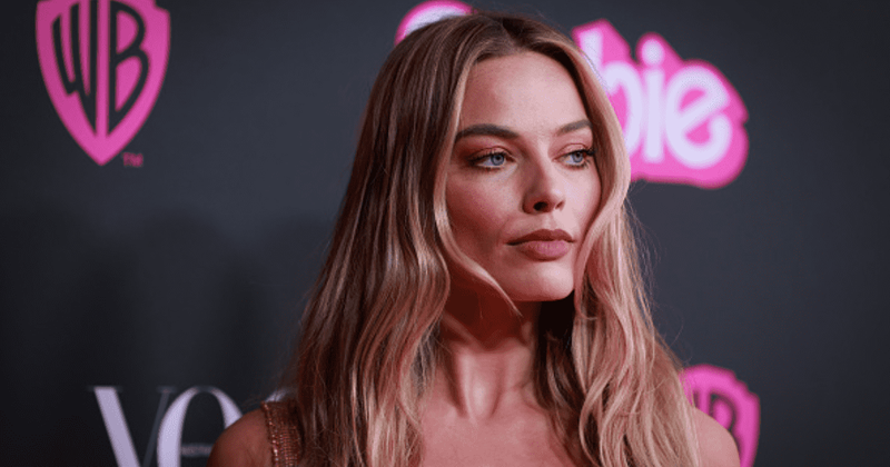 Margot Robbie glams it up in Versace pink dress showcasing her stunning ...